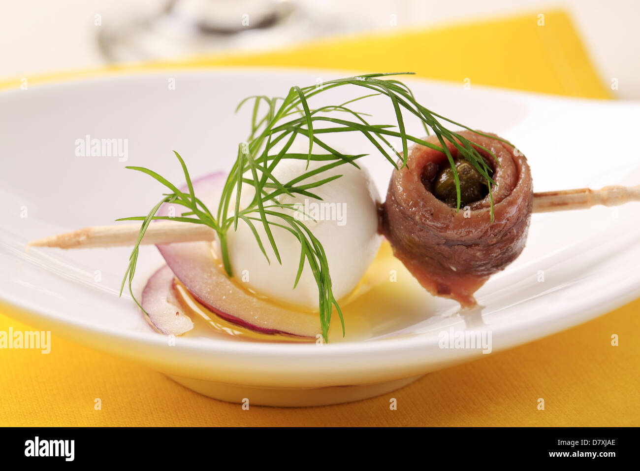 Mozzarella cheese and rolled anchovy on a stick Stock Photo - Alamy