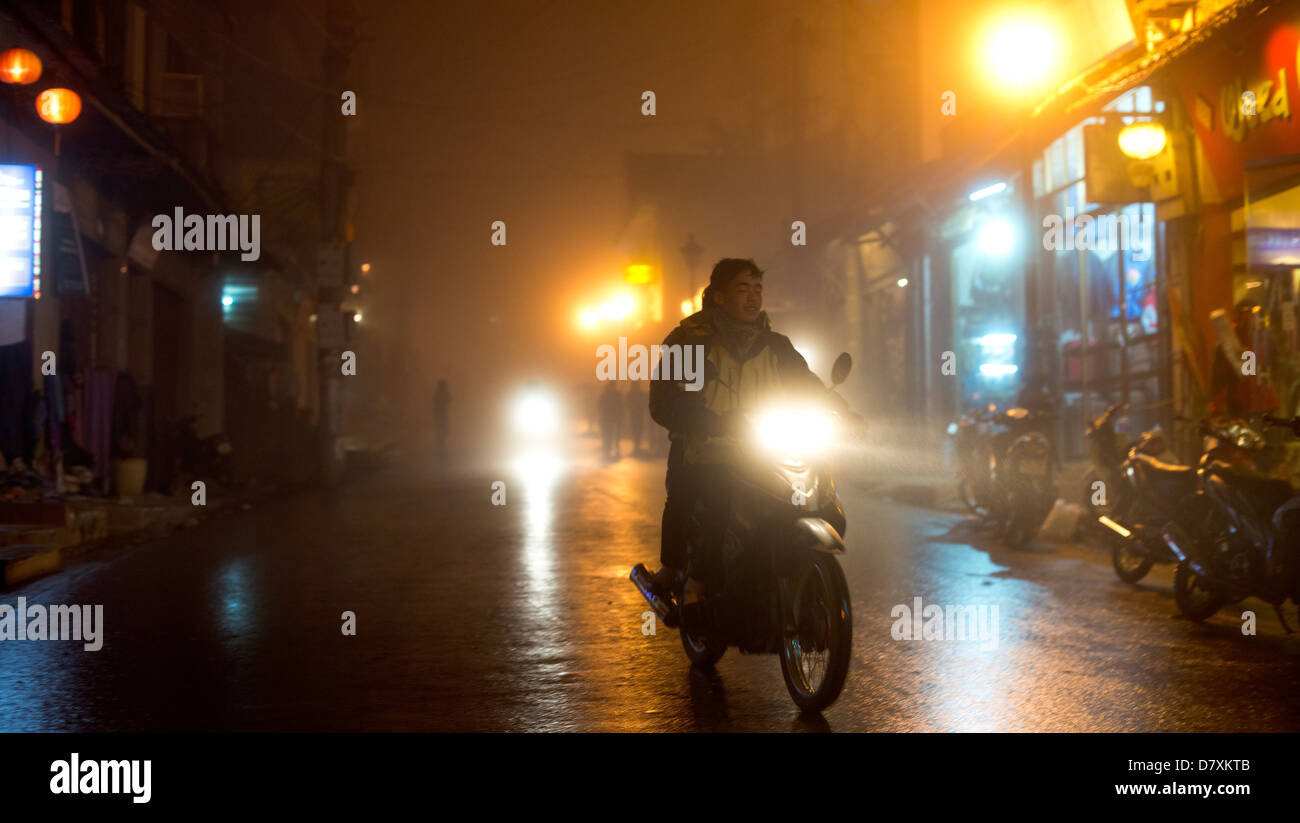 Riding through the rain at night Stock Photo - Alamy