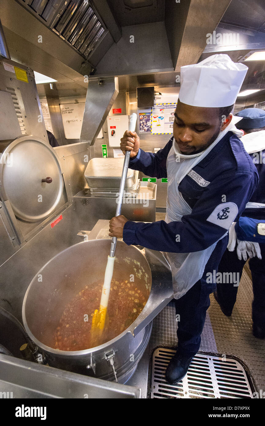 Chefs cooks preparing food in the ships main gallery onboard Royal Navy ...