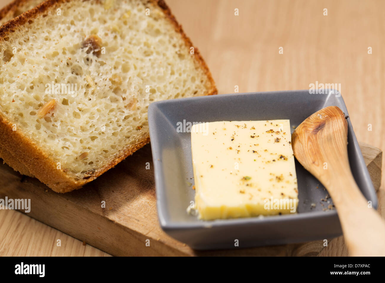 Baked bread slices and melted butter in bowl Stock Photo - Alamy