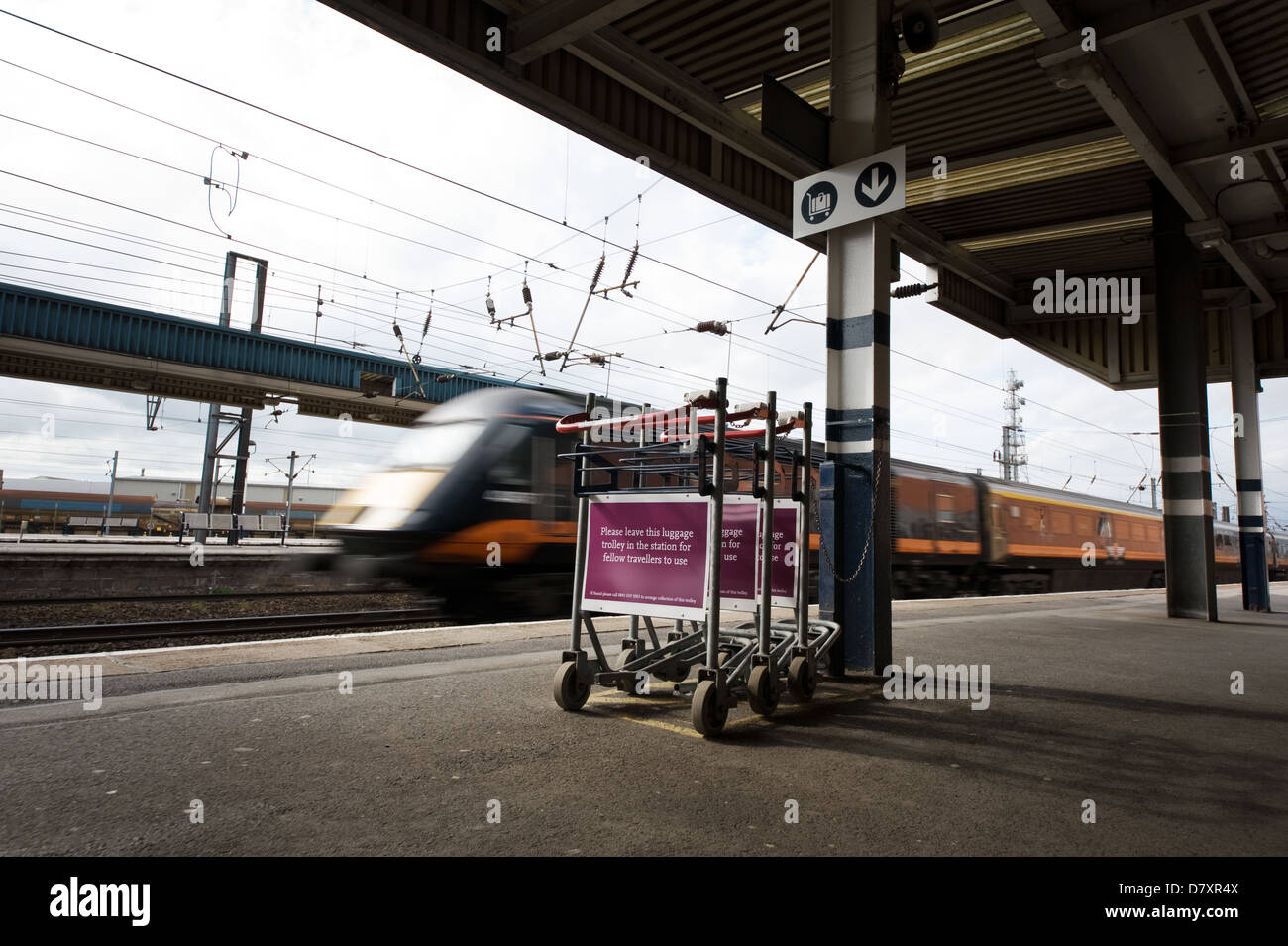 A high speed train passing through a train station, UK Stock Photo - Alamy
