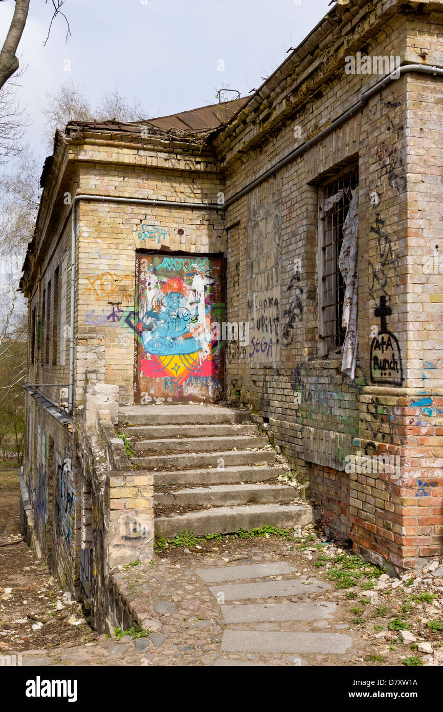 Reverse side of small city graffiti slums landscape . Outdoor spring ...