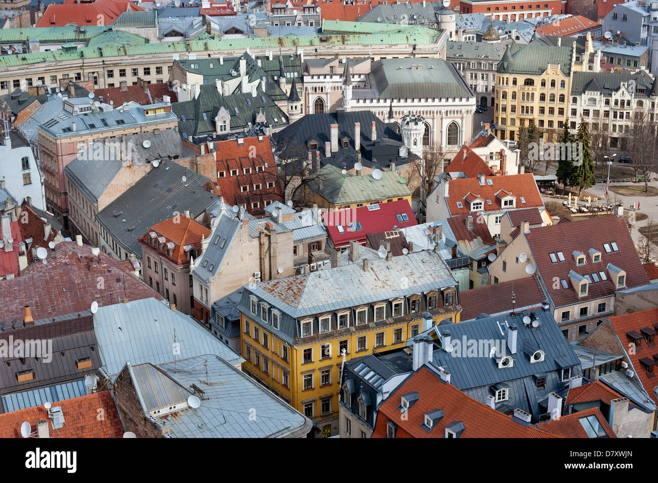Roofs, windows, walls, and pipes of the old public domain European Riga ...