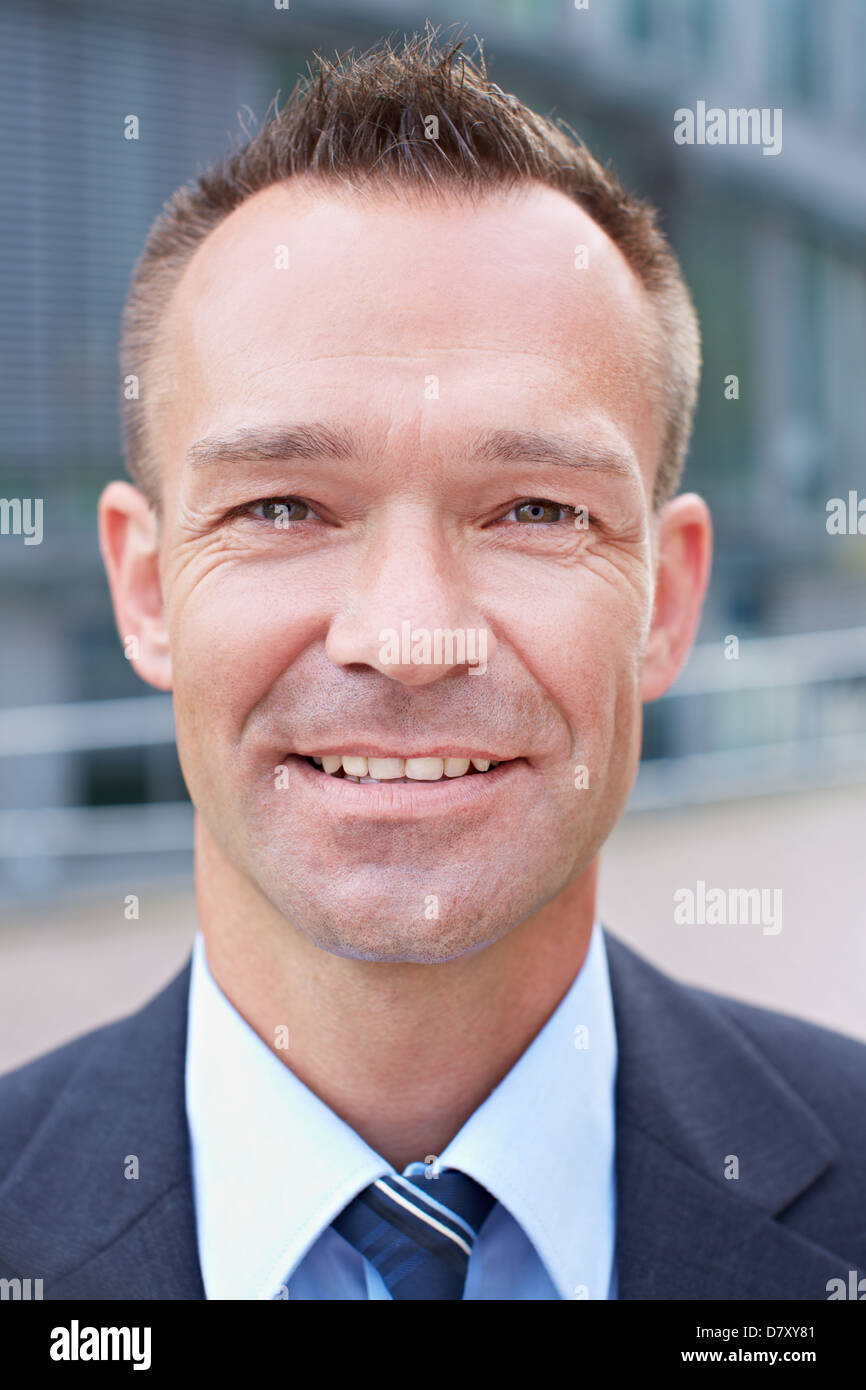 Portrait of a smiling attractive business man outside his office Stock ...