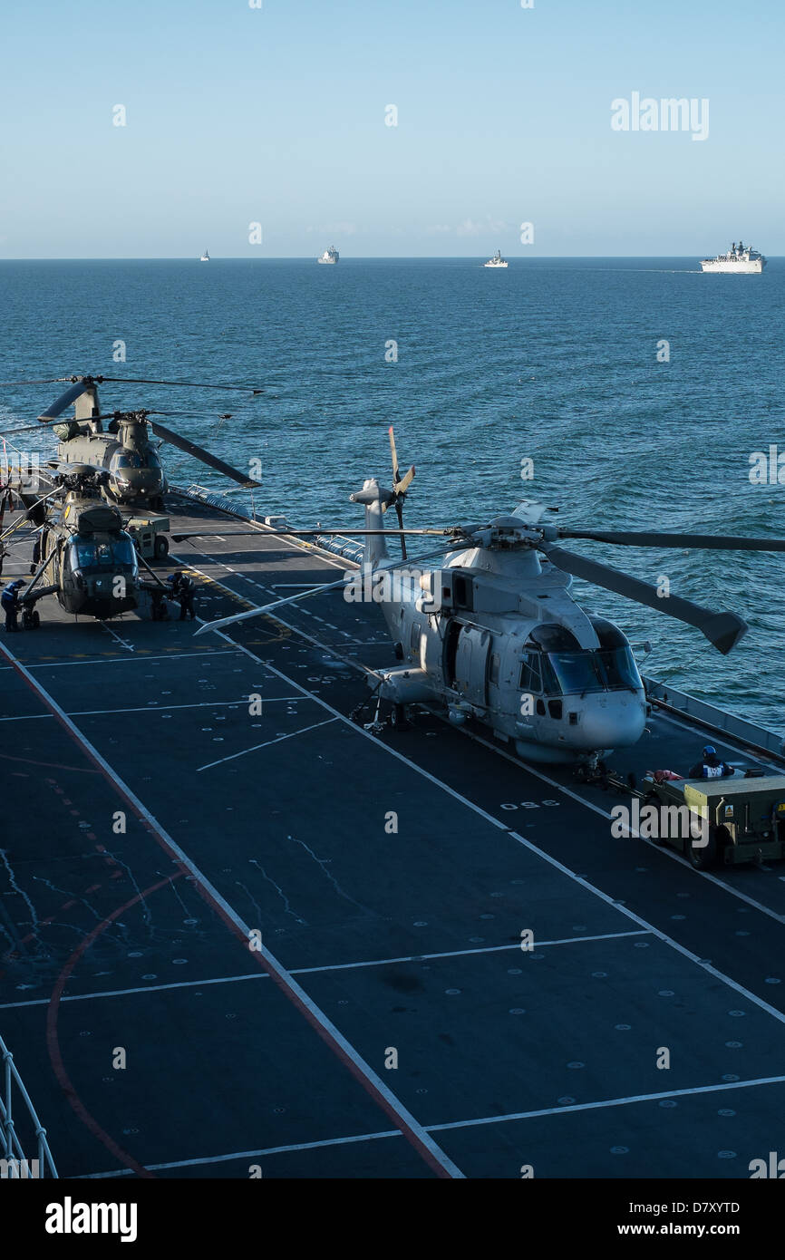 Merlin HM2, RAF Chinook and Royal Navy Sea King on the flight deck of ...