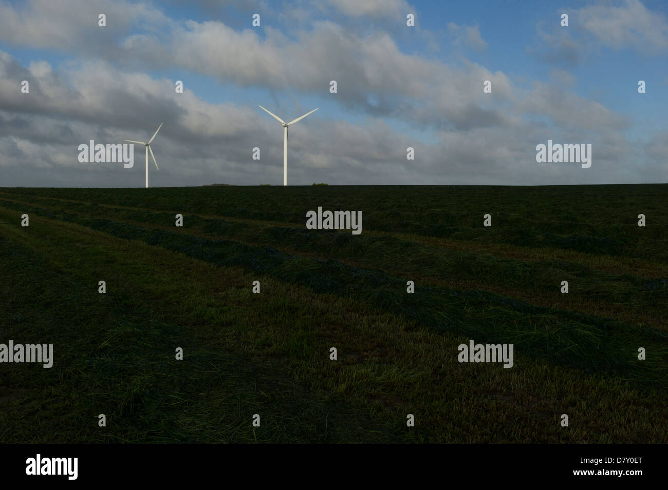 Wind turbine sagainst blue sky and clouds, Normandy, France Stock Photo ...