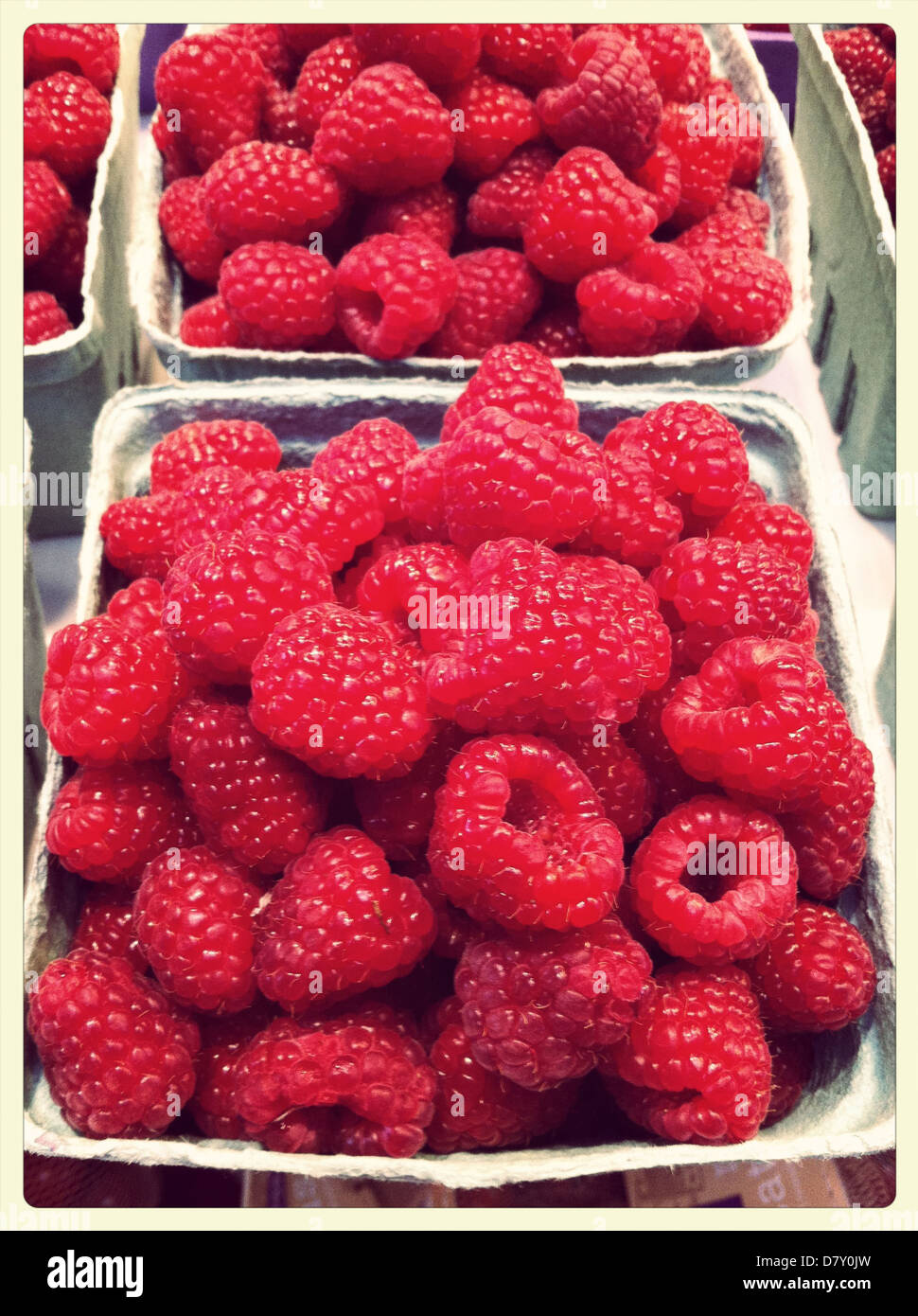 Close up of punnet of raspberries Stock Photo - Alamy