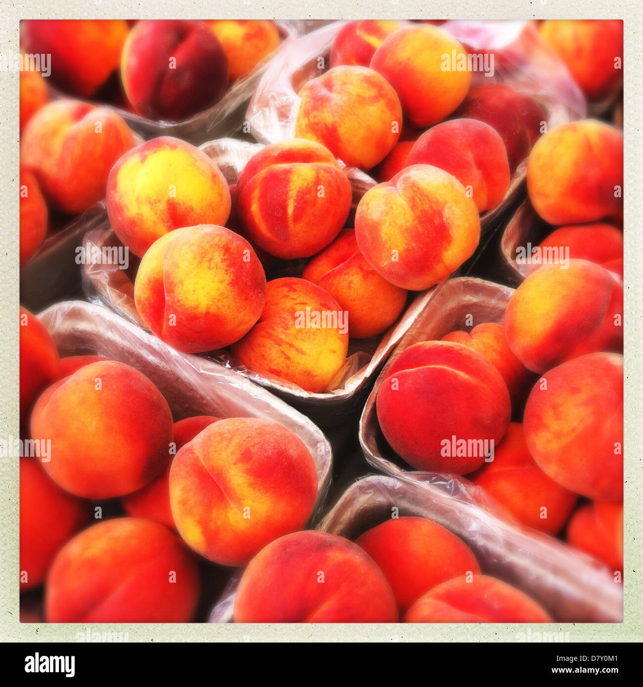 Close up of punnets of peaches Stock Photo - Alamy