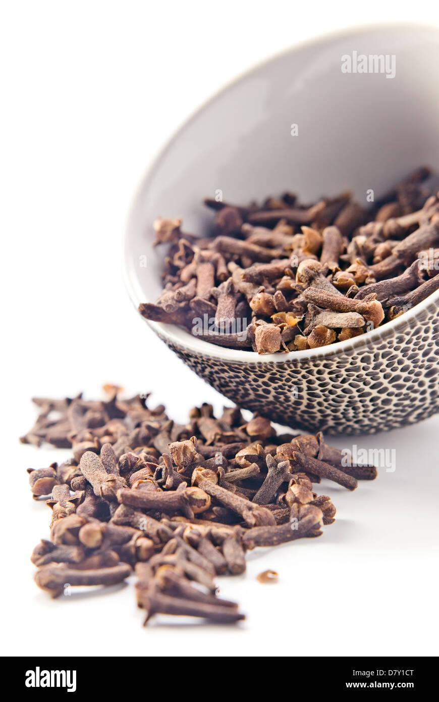 cloves in a small ceramic cup ,isolated on a white background Stock ...