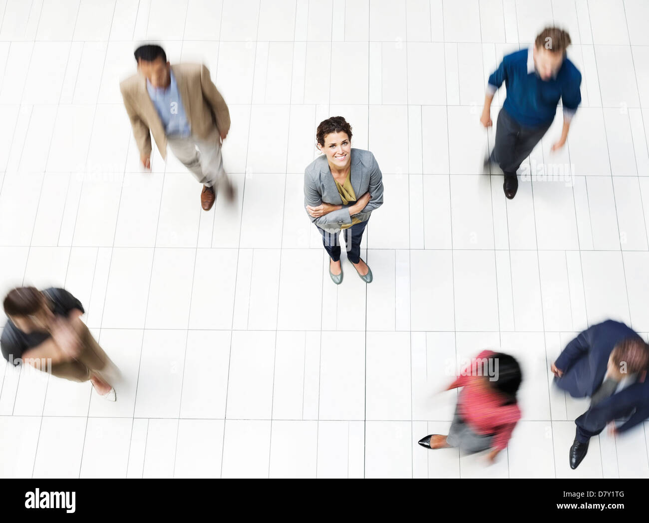Businesswoman standing in busy office hallway Stock Photo - Alamy Businesswoman standing in busy office hallway Stock Photo - Alamy