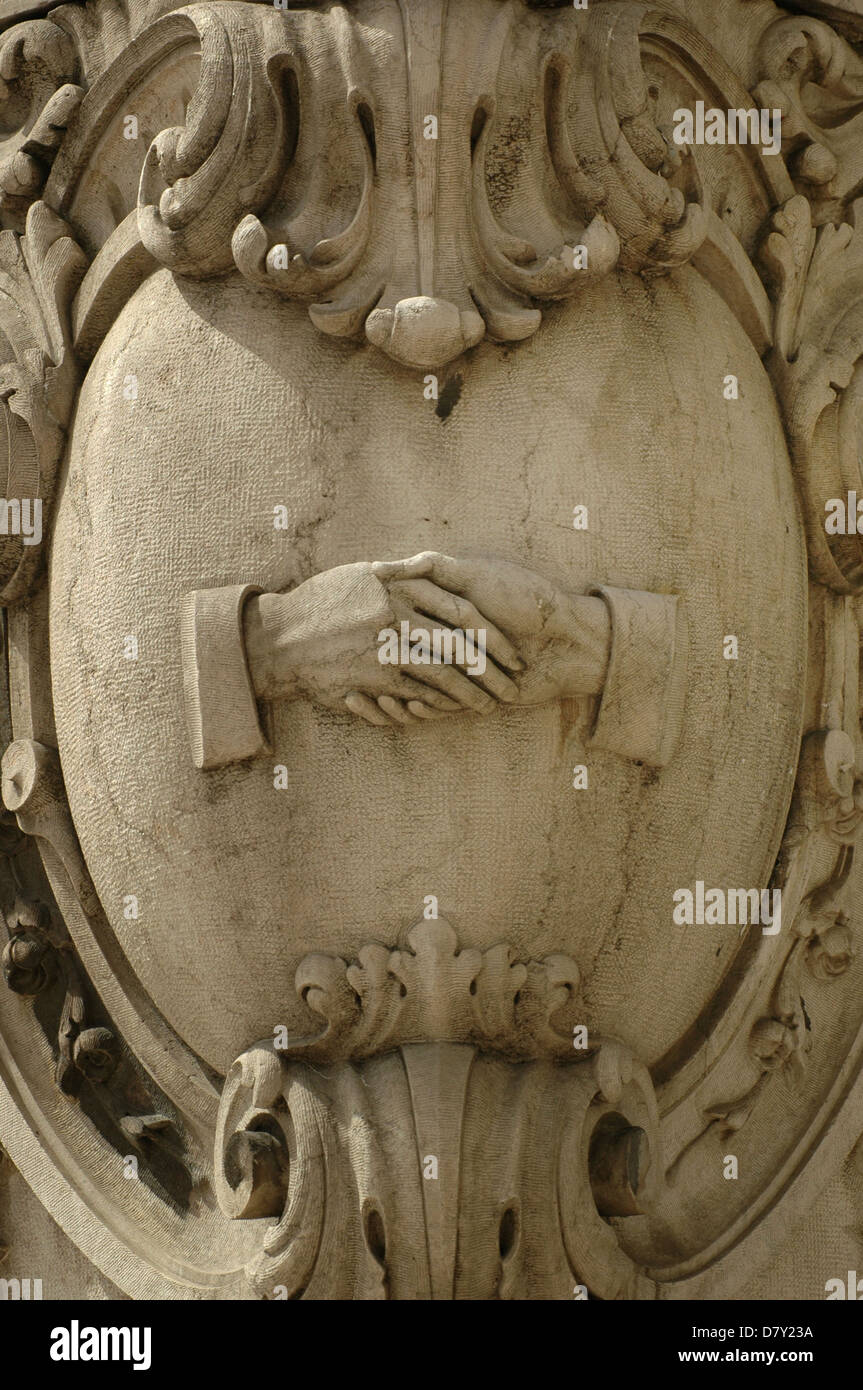 Relief ornament depicting shaking hands on the corner of Praca da ...