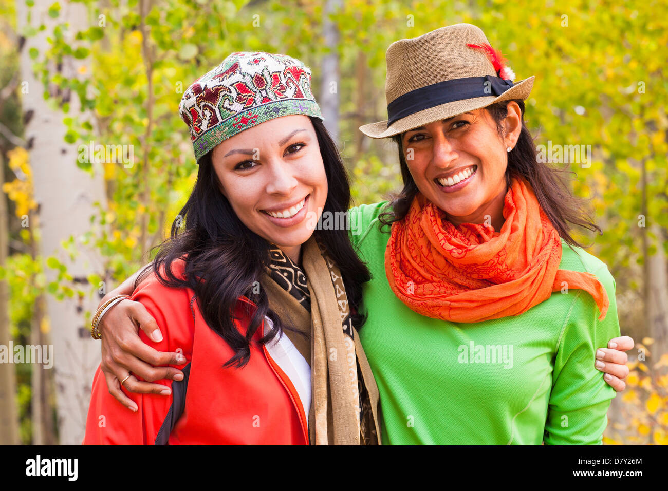 Friends hugging in forest Stock Photo - Alamy