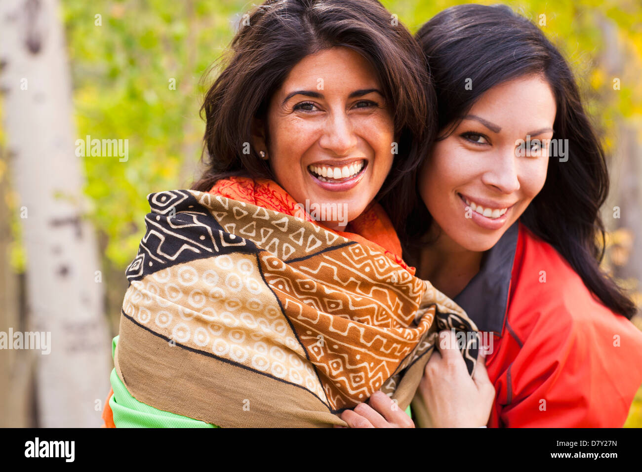 Happy latina friends hugging in hi-res stock photography and images - Alamy