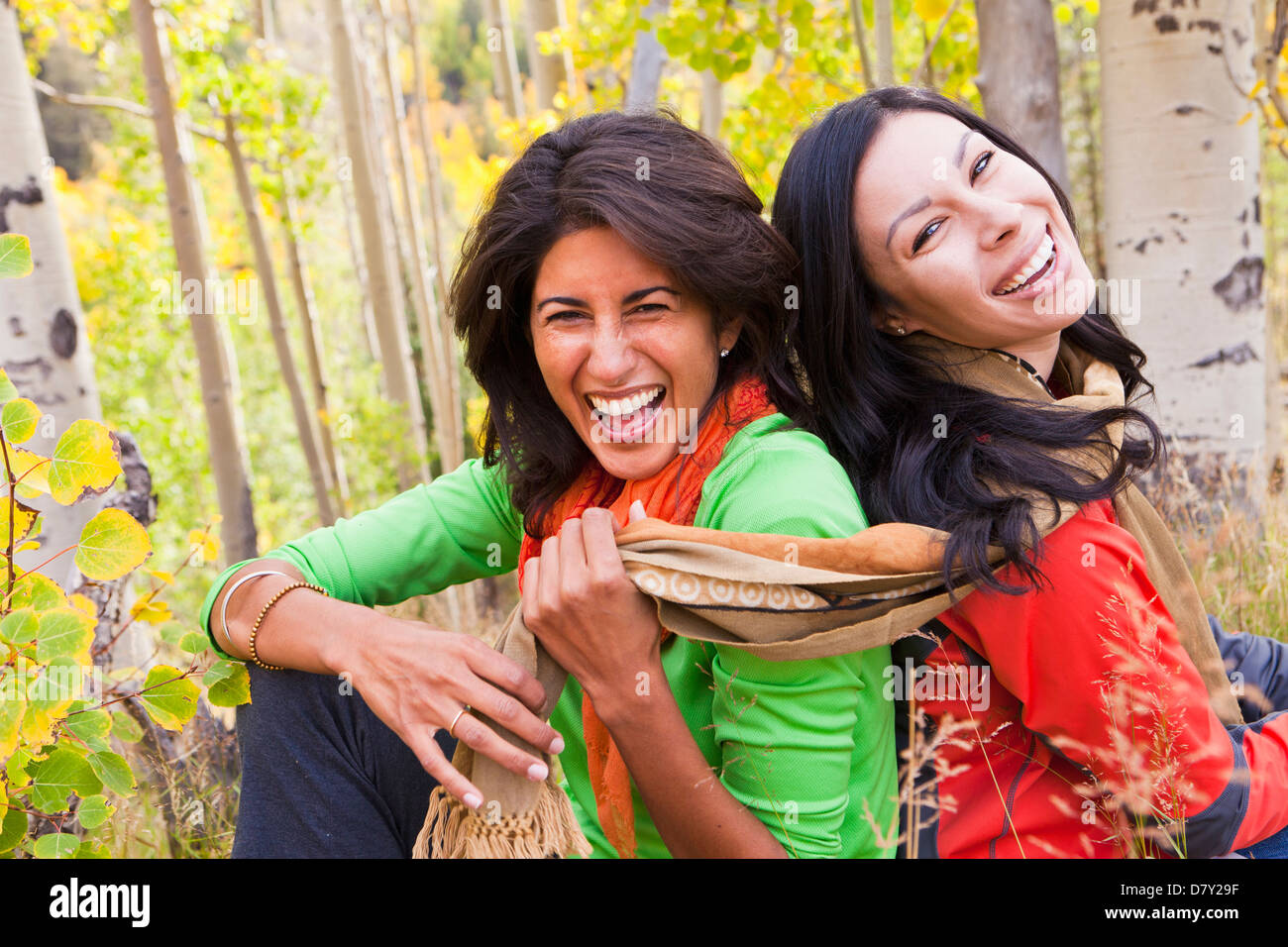 Laughing friends enjoying forest Stock Photo - Alamy