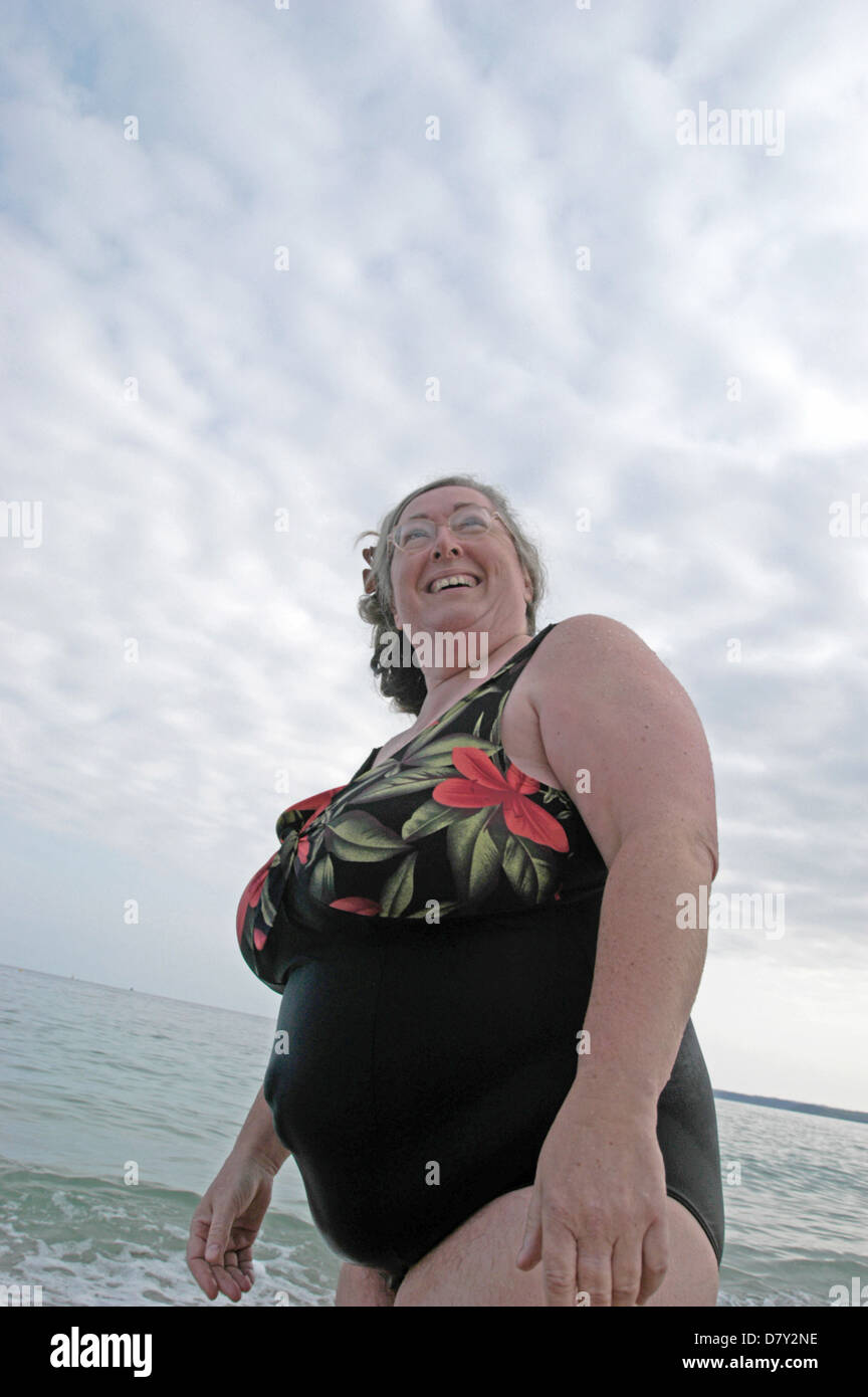 Large fat lady on beach hi-res stock photography and images - Alamy