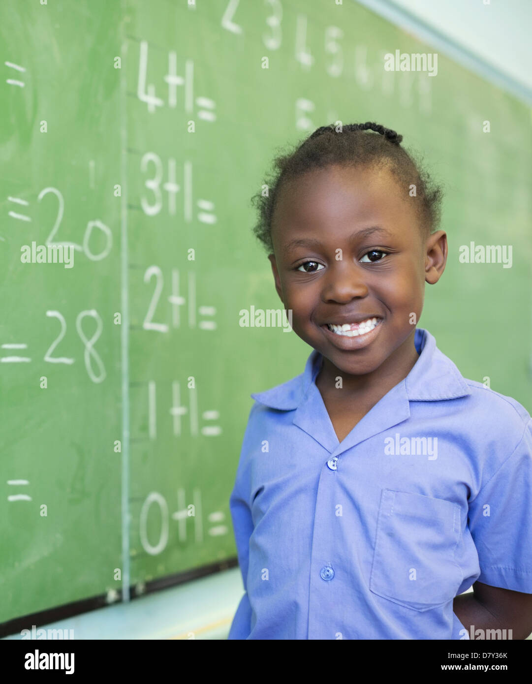 Student smiling at chalkboard Stock Photo - Alamy
