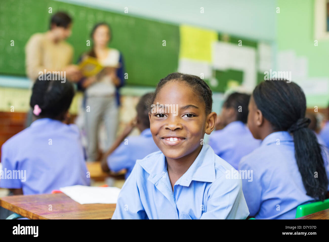Student smiling in class Stock Photo - Alamy