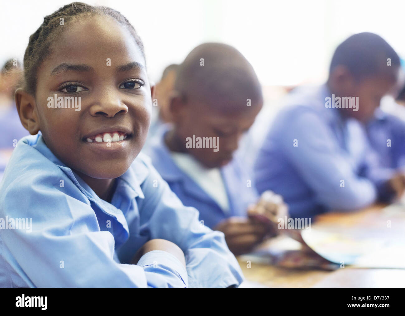 Student smiling in class Stock Photo - Alamy