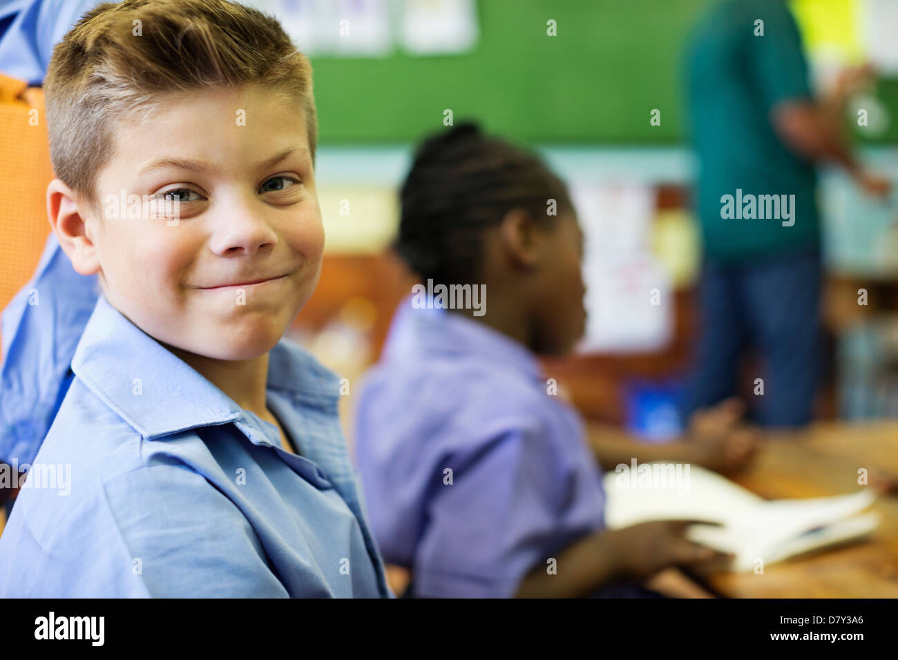 Student smiling in class Stock Photo - Alamy