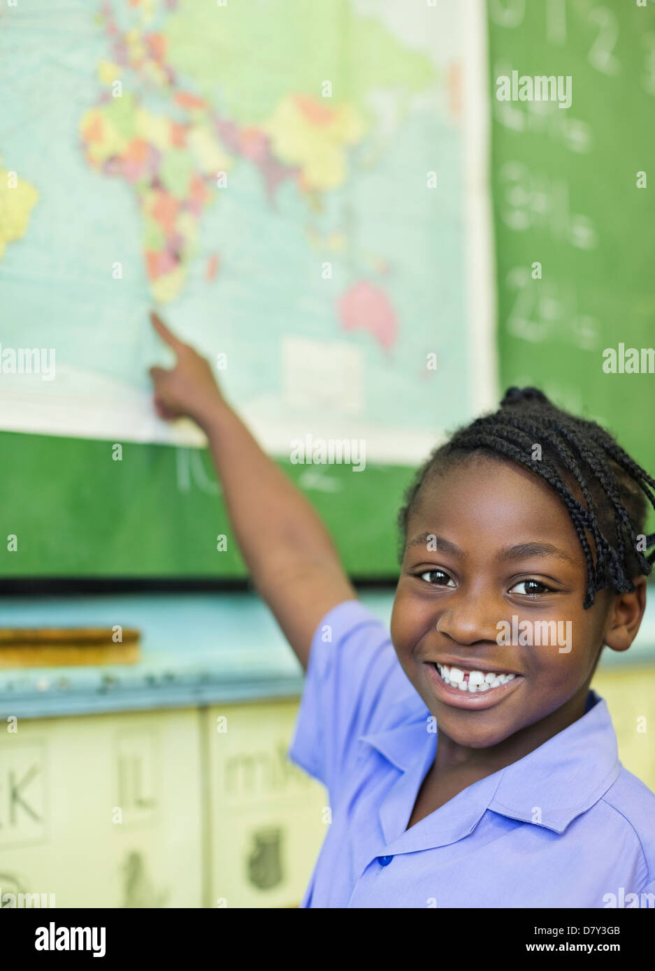 Student using world map in class Stock Photo - Alamy