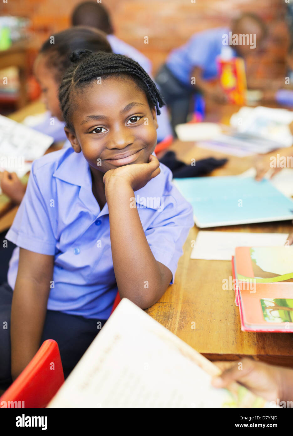 Student smiling in class Stock Photo - Alamy