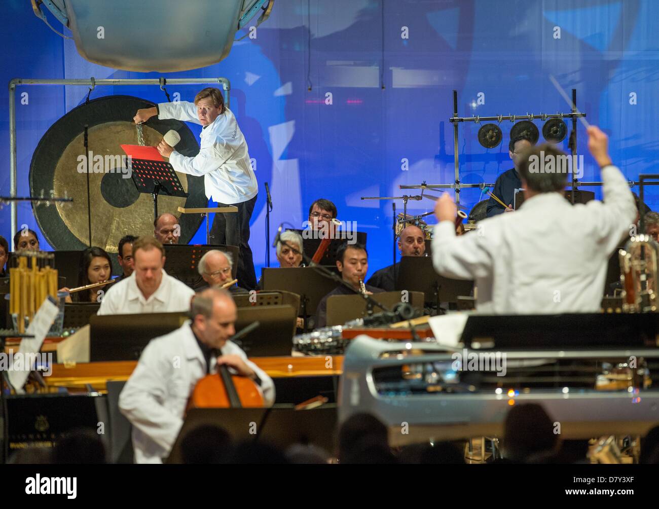 Musician Magnus Lindberg (back, playing the gong) performs with the New ...