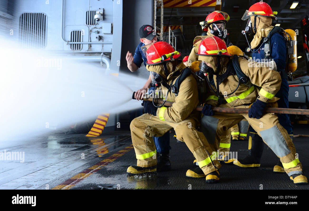 Sailors perform a firefighting exercise Stock Photo - Alamy