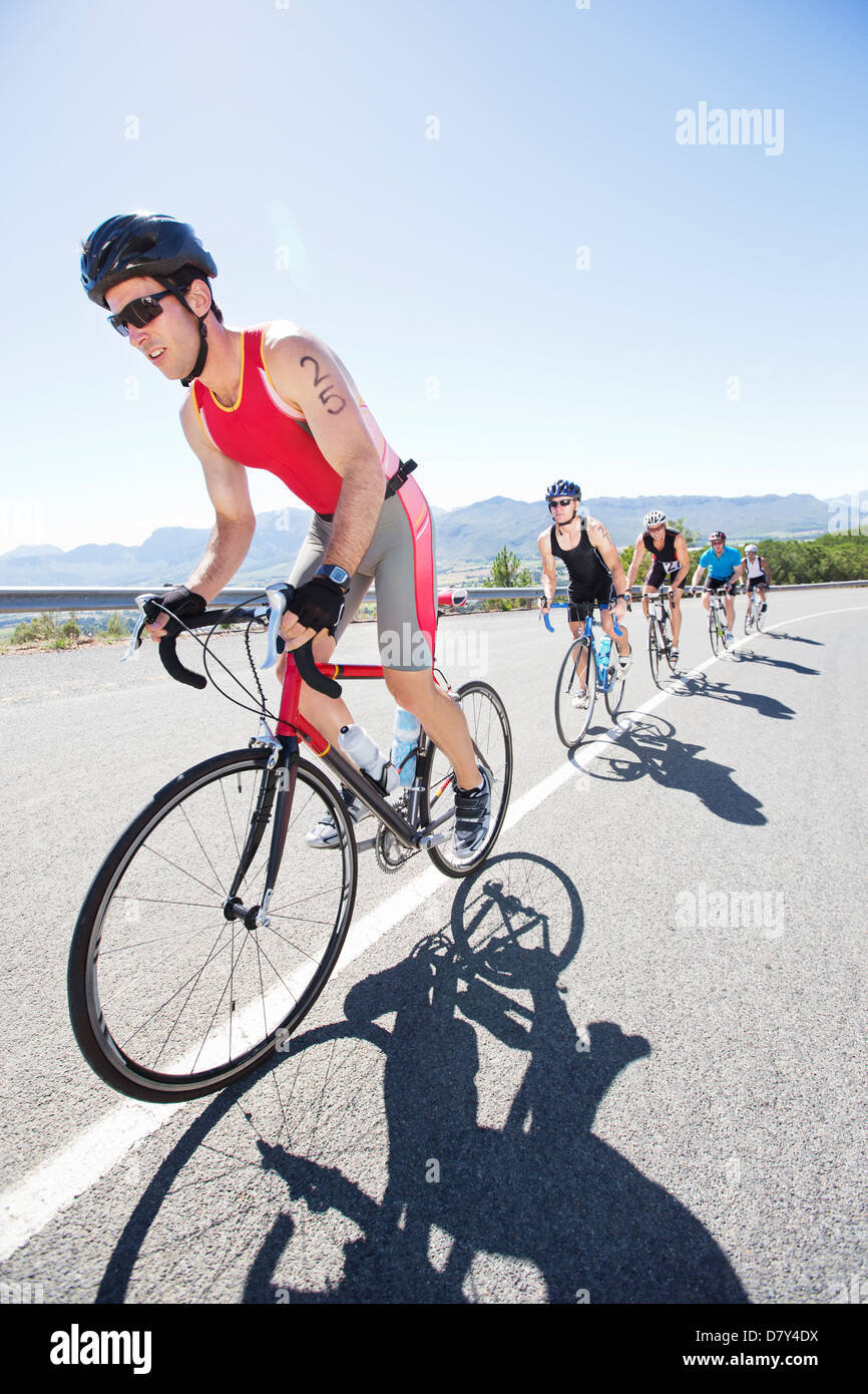 Cyclists in race on rural road Stock Photo - Alamy