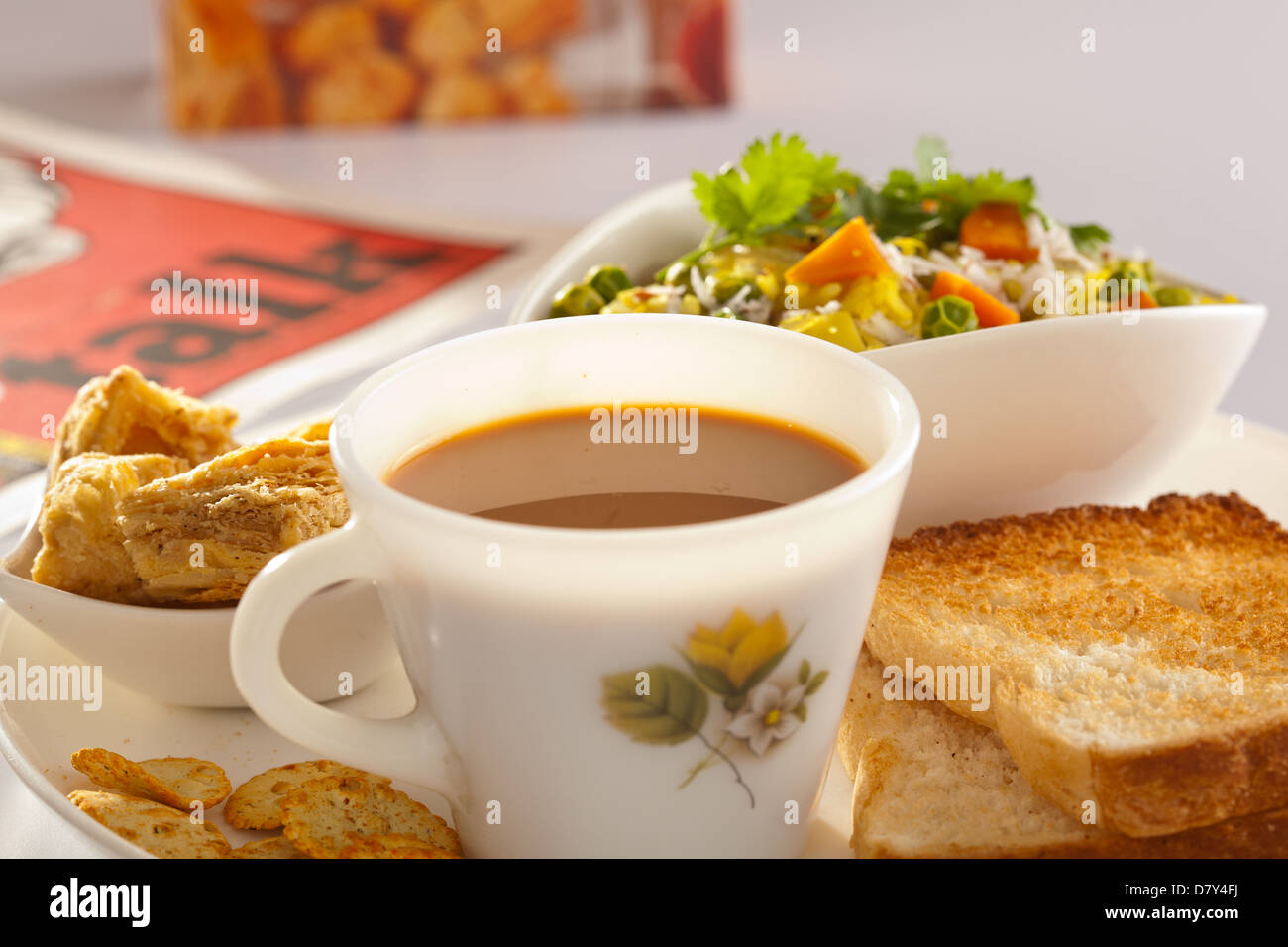 Breakfast- Tea, Poha with bread and Biscuit Stock Photo - Alamy