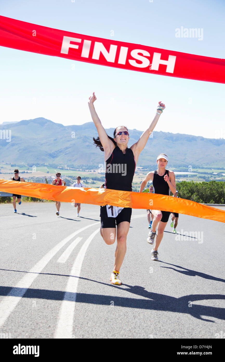 Runner crossing race finish line Stock Photo - Alamy Runner crossing race finish line Stock Photo - Alamy