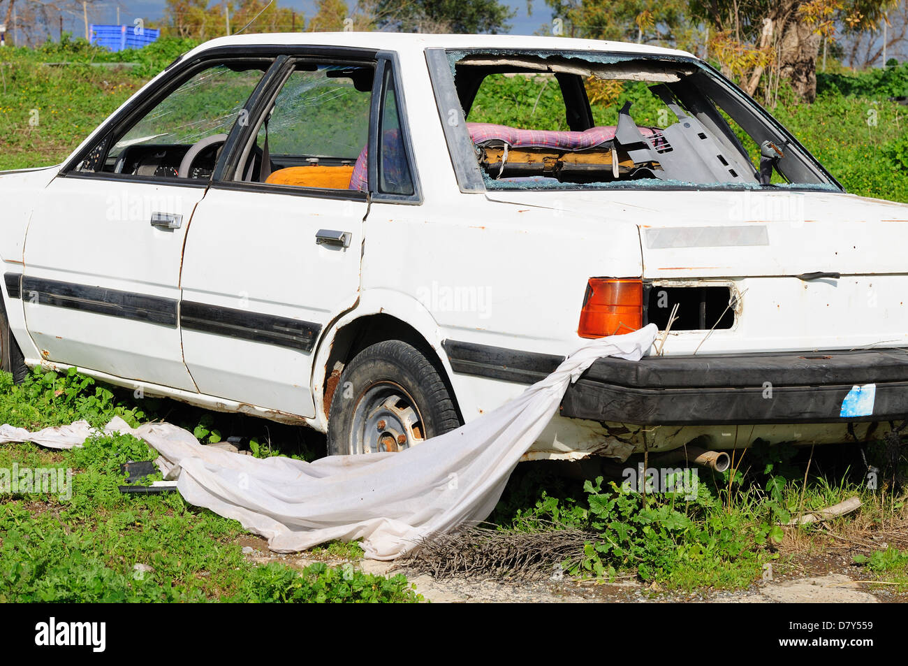 Old abandoned car left in the field Stock Photo - Alamy