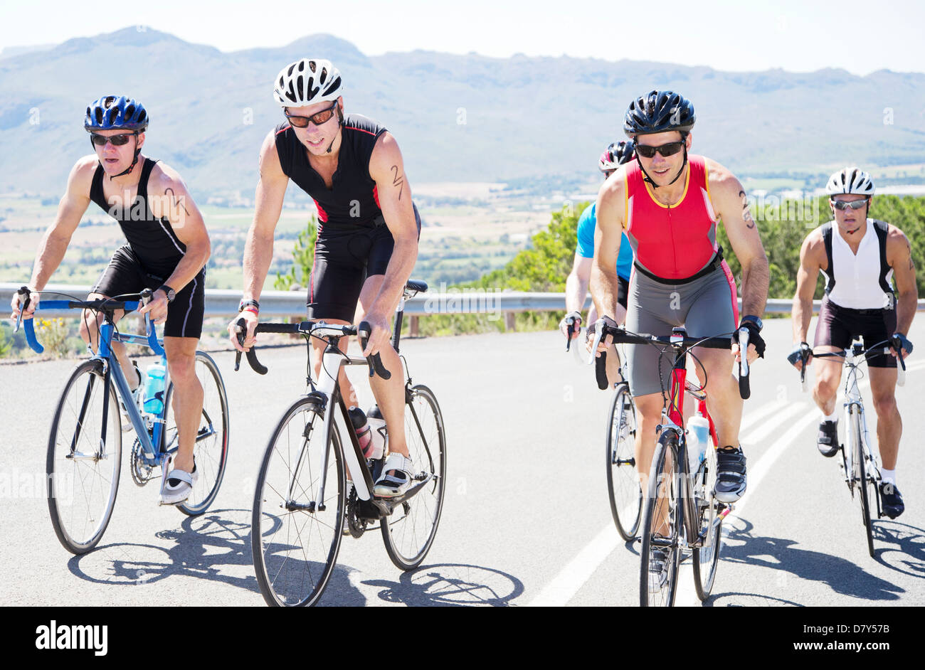 Cyclists in race on rural road Stock Photo - Alamy