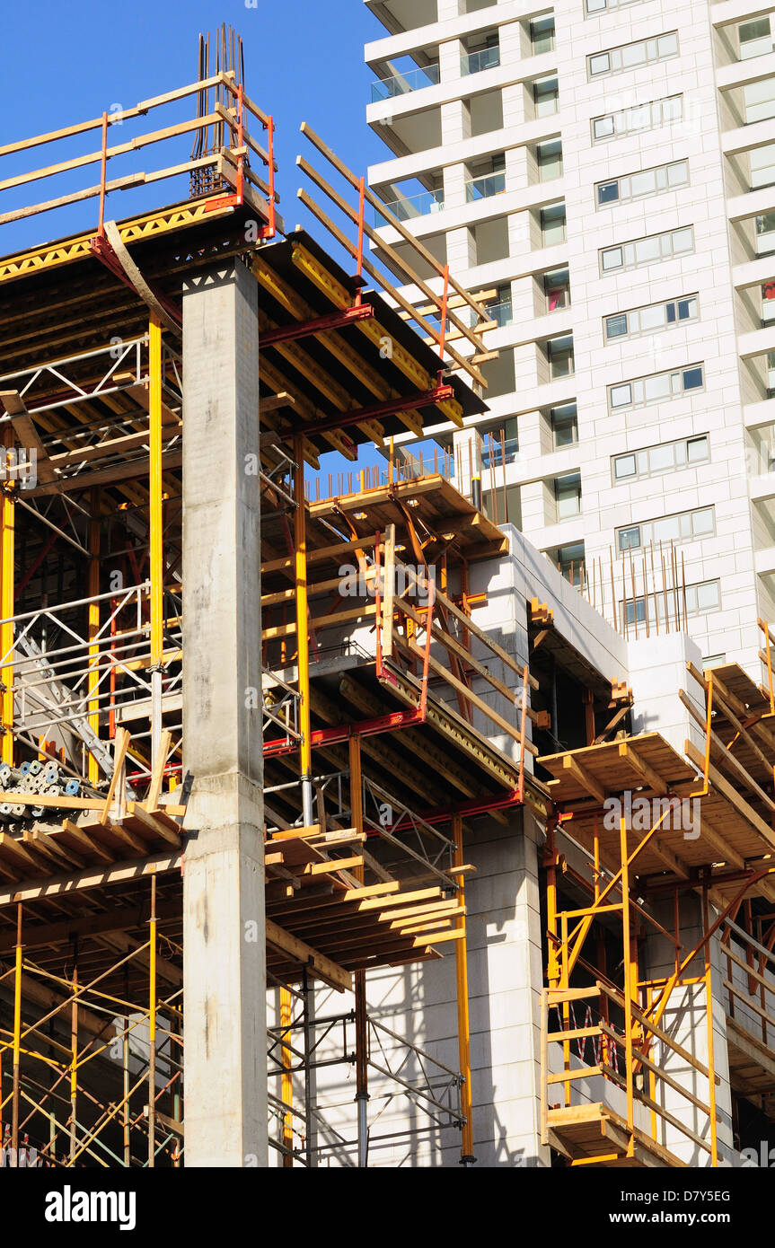View of a construction site with the new building at the background ...