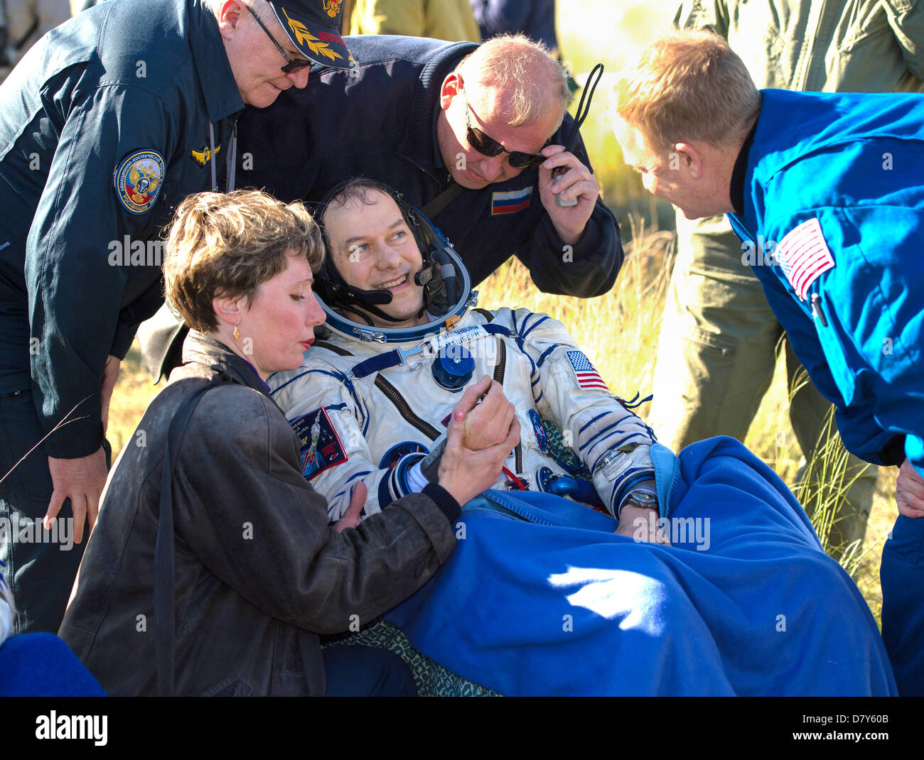 NASA astronaut Tom Marshburn is attended to outside the Soyuz Capsule ...