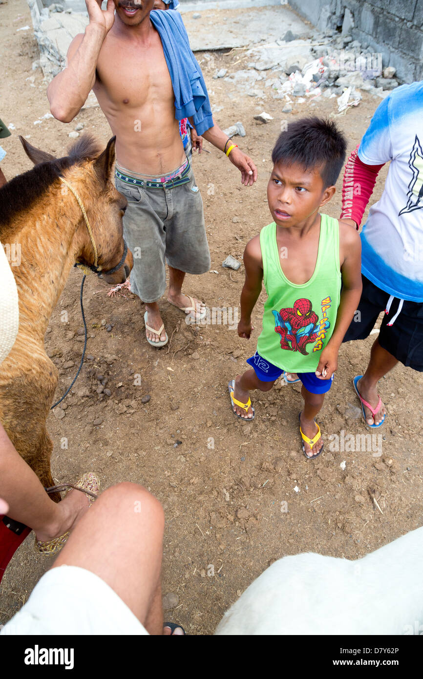 Little Boy riding Tourists up to the Volcano Taal in the Philippines ...