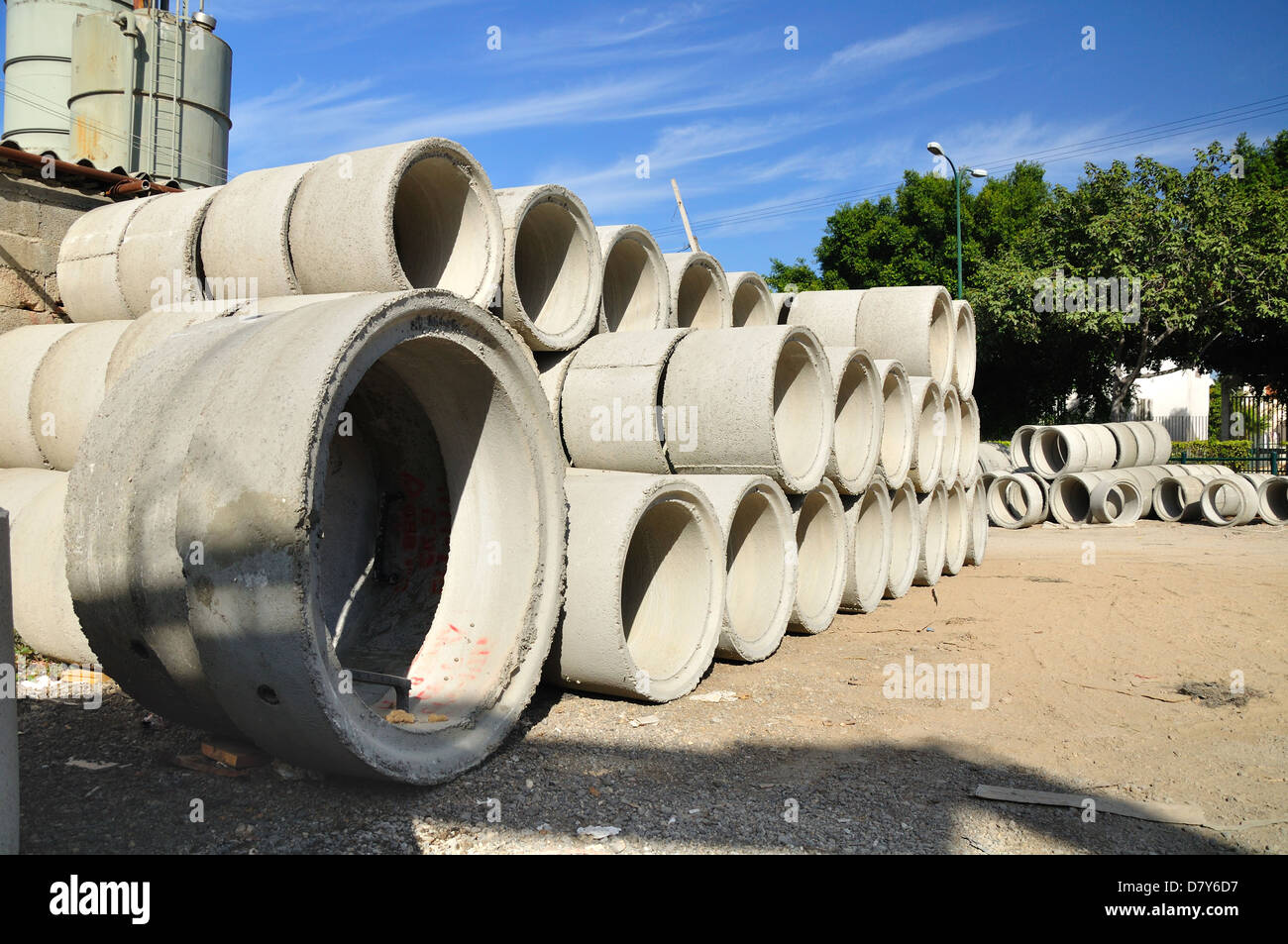 Pile of big pipes at construction site Stock Photo - Alamy