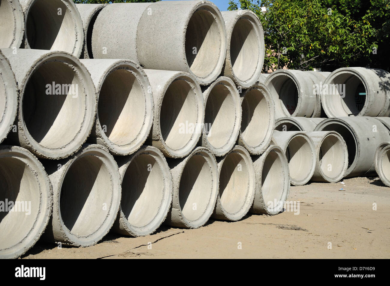 Pile of big pipes at construction site Stock Photo - Alamy