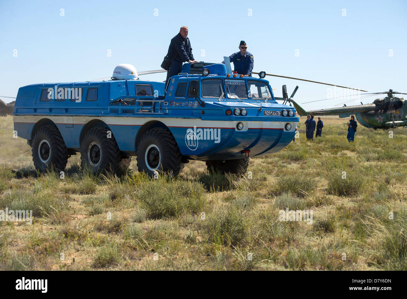 A Russian all terrain vehicle takes Expedition 35 crew to a helicopter ...