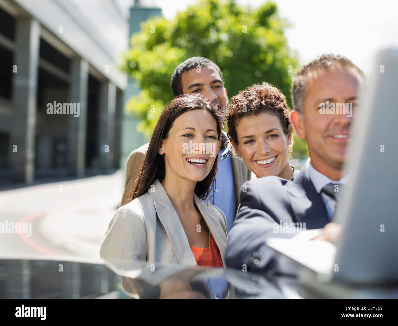 Business people using laptop outdoors Stock Photo - Alamy