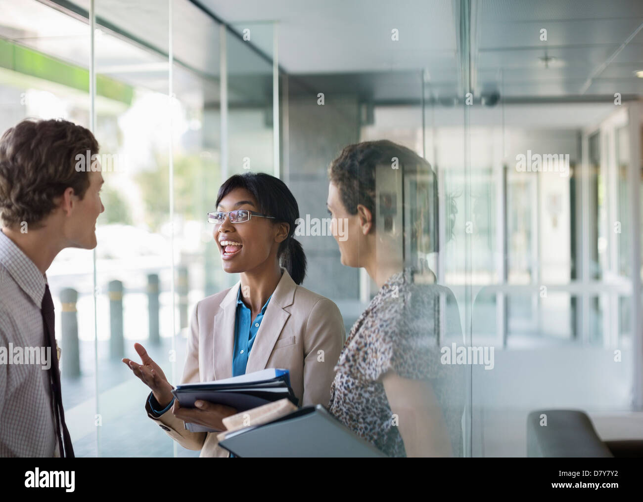 Business people standing in corridor 20 29 years hi-res stock ...