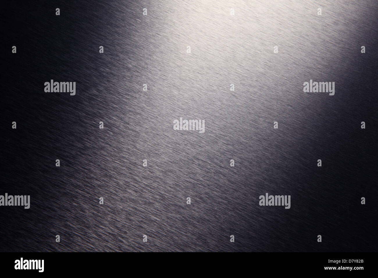 A close-up view of a brushed stainless steel surface with dramatic ...