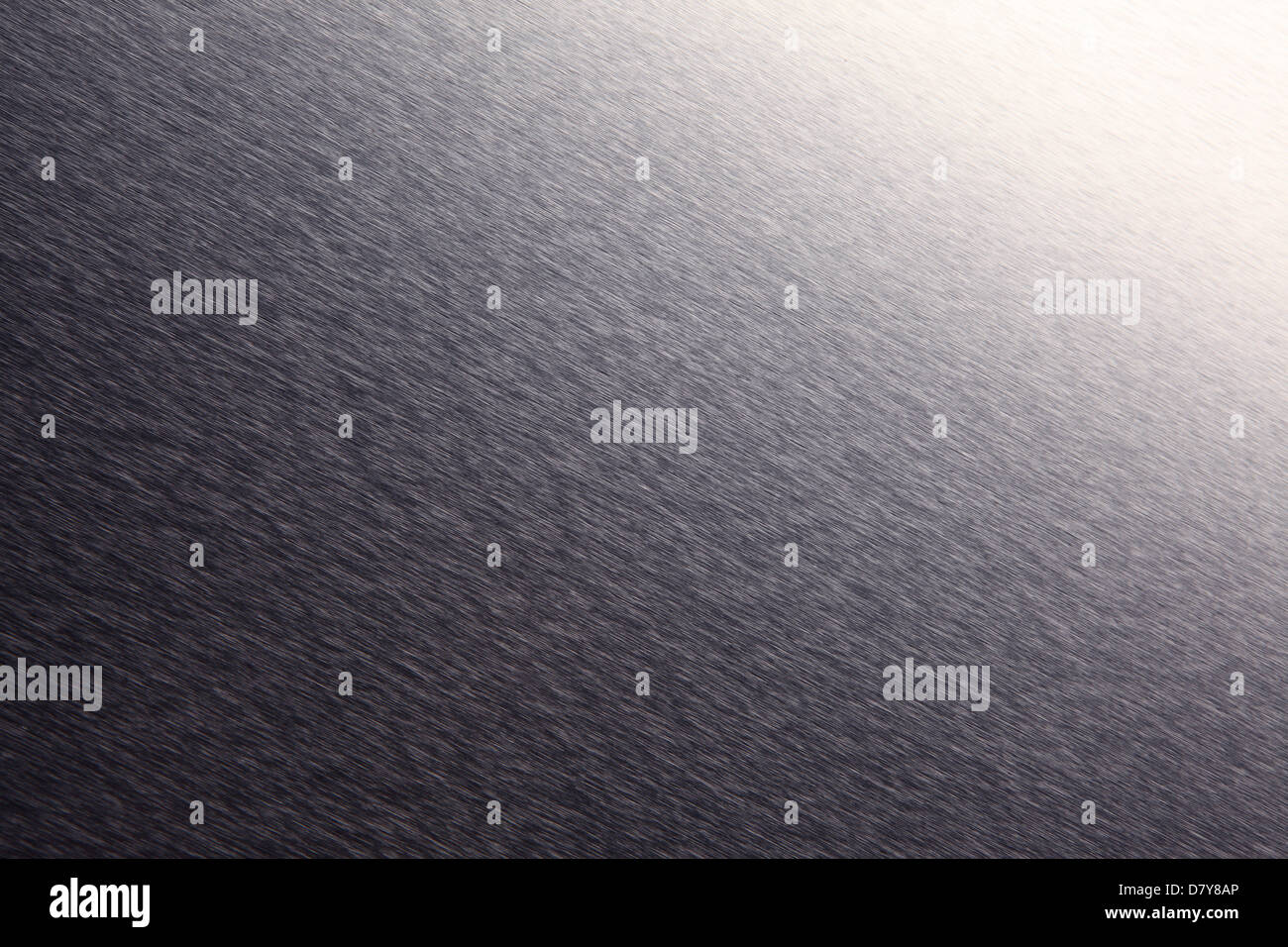 A close-up view of a brushed stainless steel surface with dramatic ...