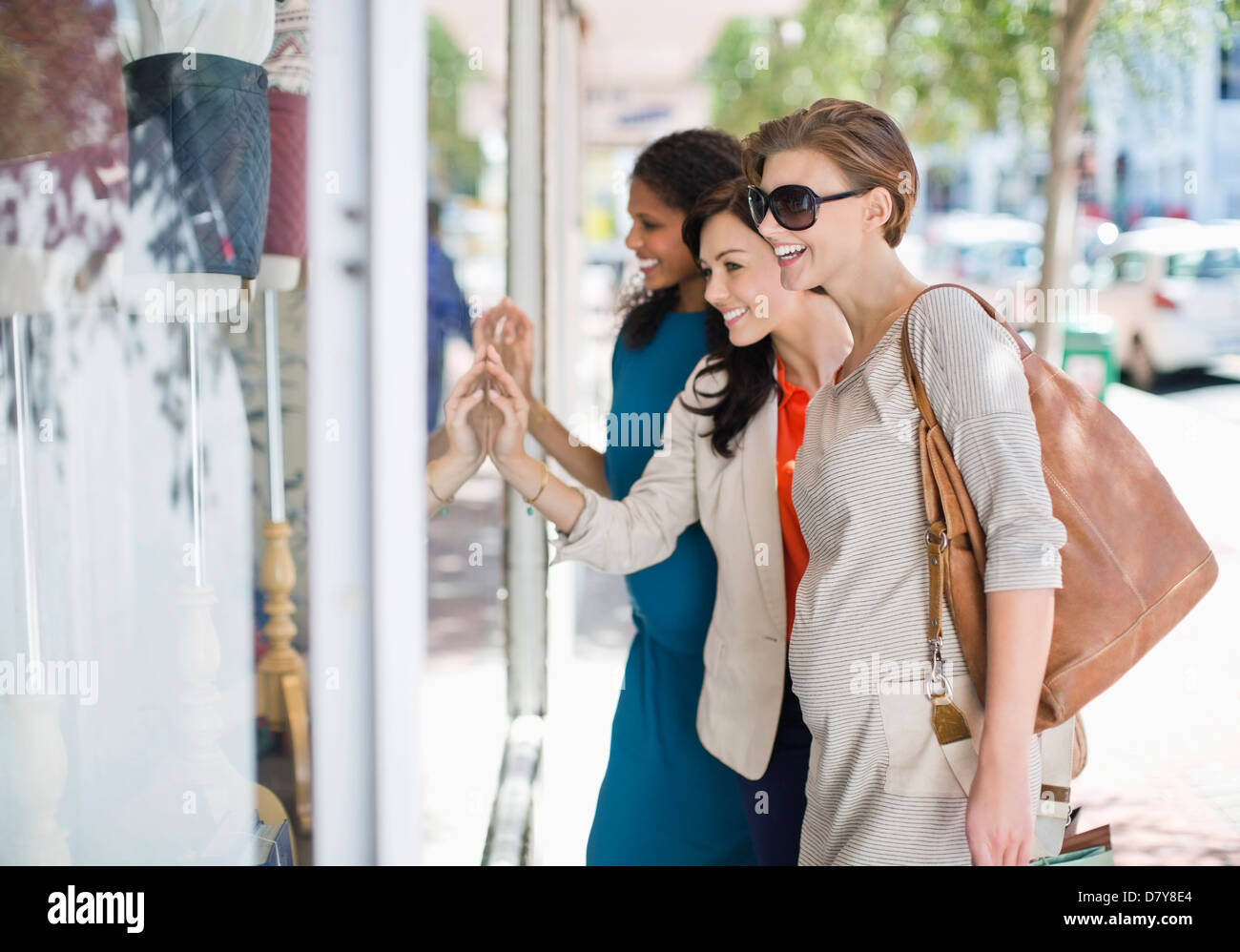 Women window shopping on city street Stock Photo - Alamy