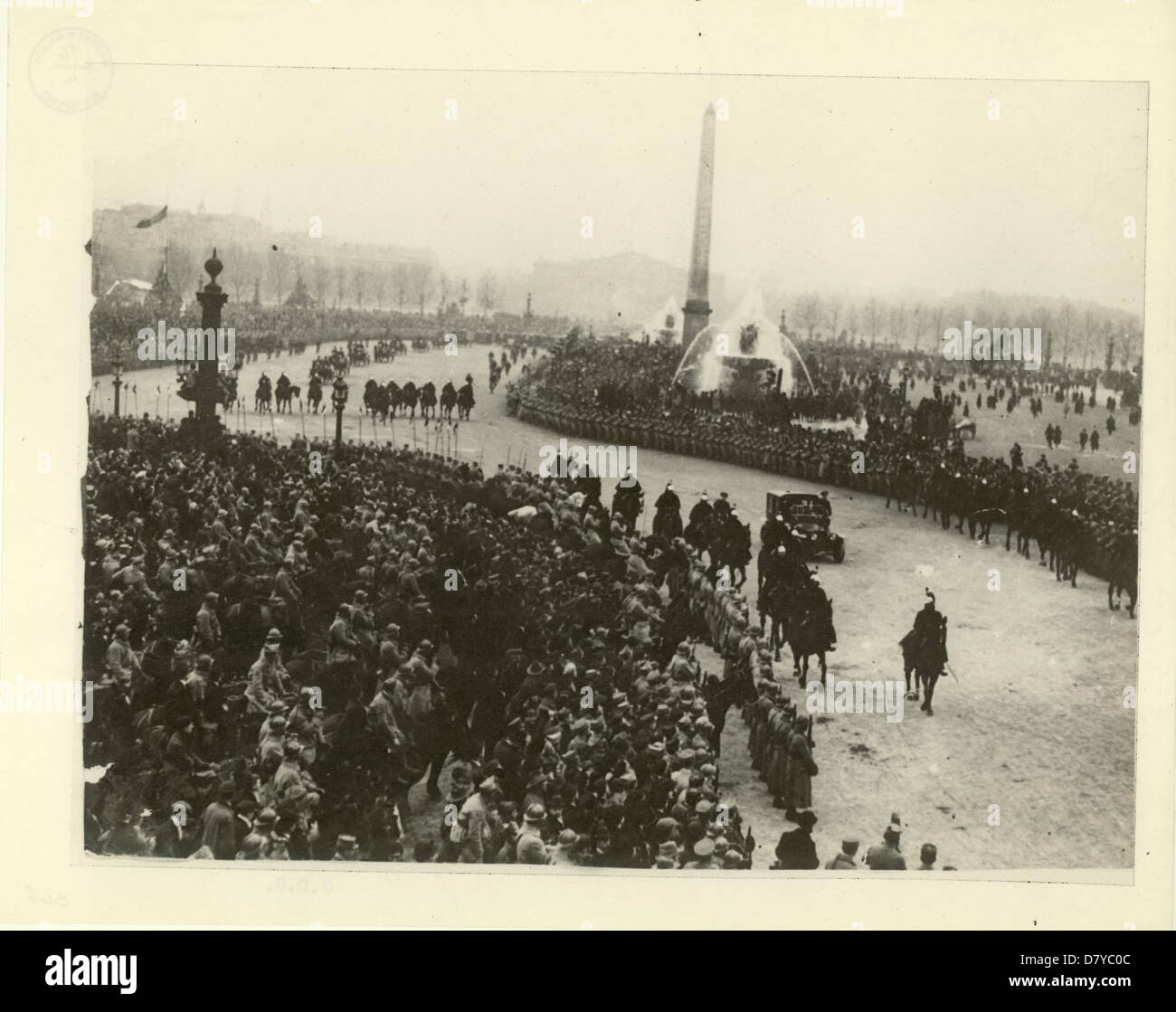 This image captures a parade moving through Paris, possibly celebrating ...
