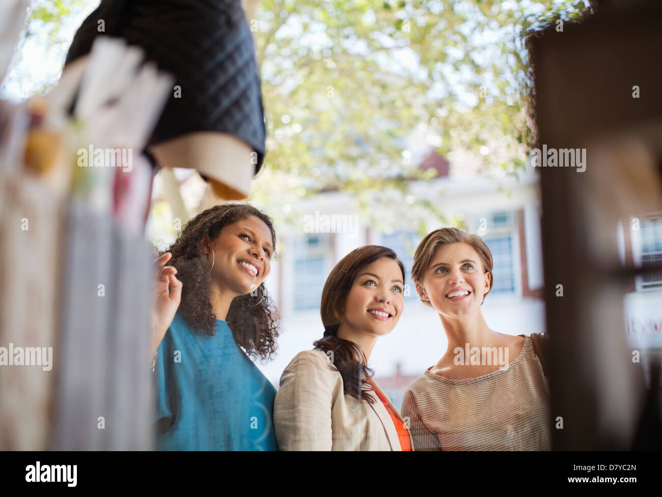 Women window shopping on city street Stock Photo - Alamy