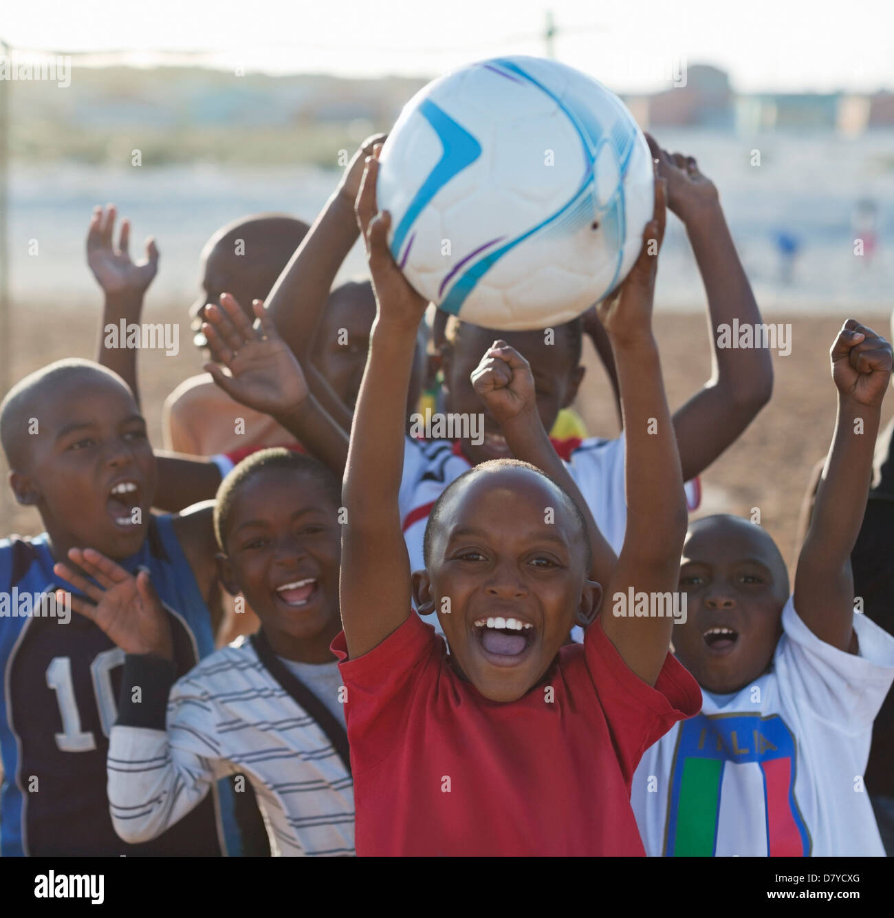 Children playing football in square hi-res stock photography and images ...