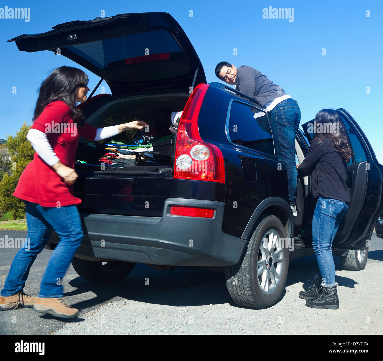 Black family car hi-res stock photography and images - Alamy