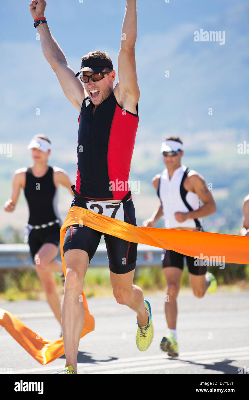Runner crossing race finish line Stock Photo - Alamy Runner crossing race finish line Stock Photo - Alamy