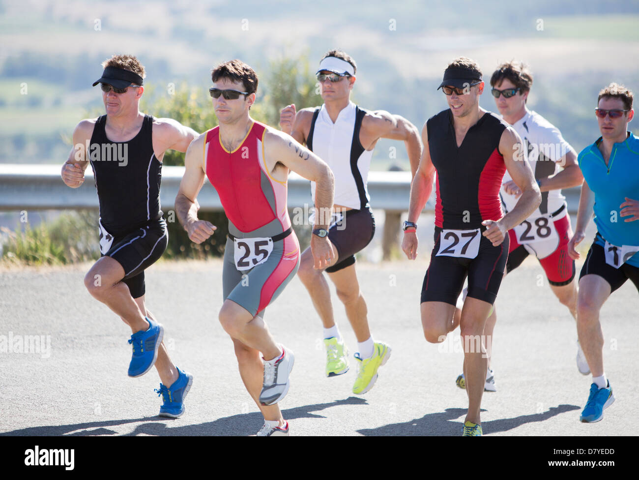 Runners in race on rural road Stock Photo - Alamy
