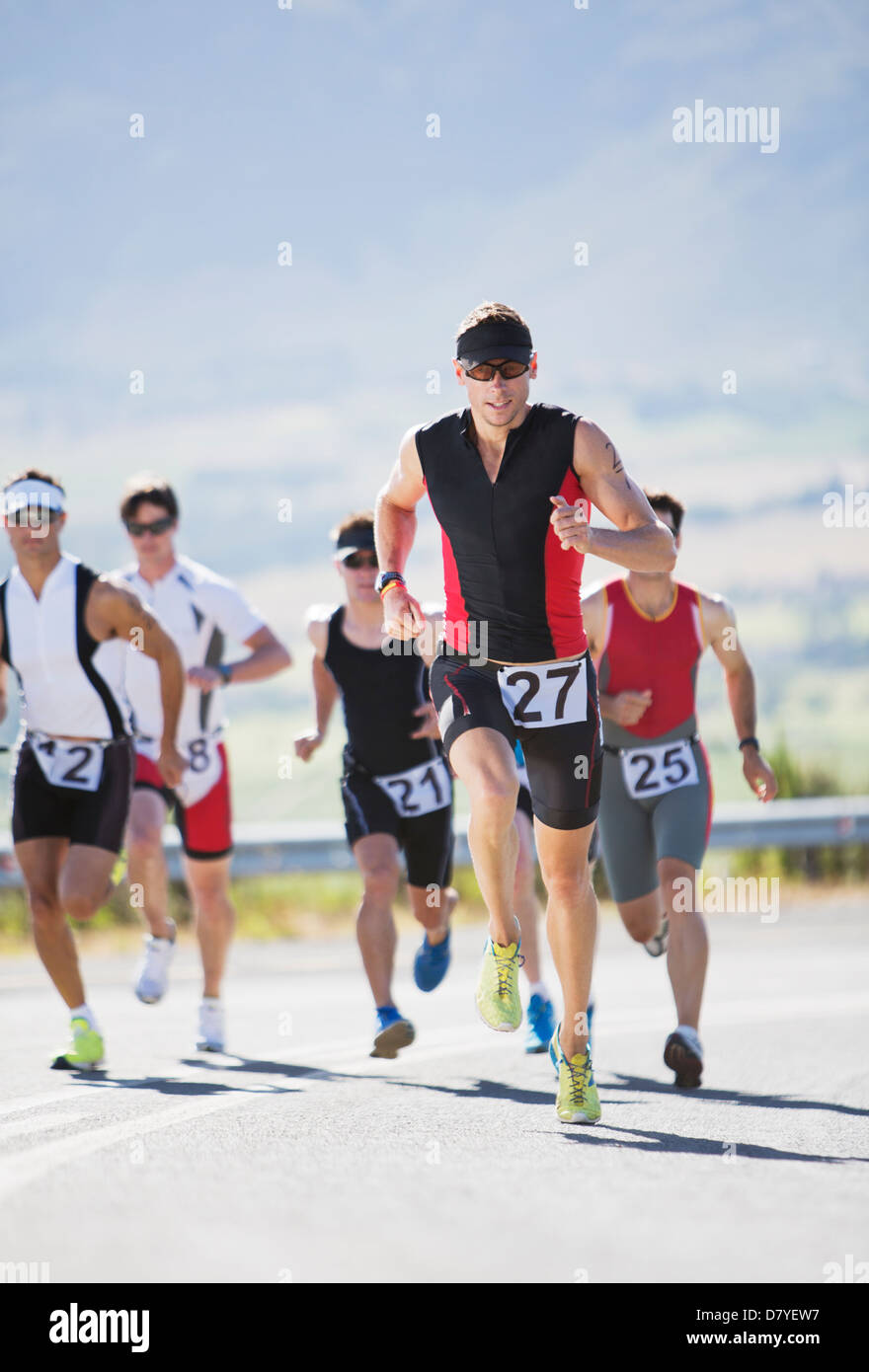 Runners in race on rural road Stock Photo - Alamy